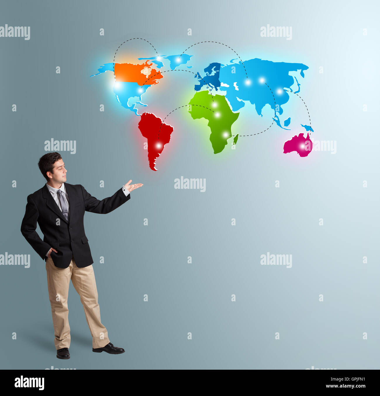 young man presenting colorful world map Stock Photo - Alamy