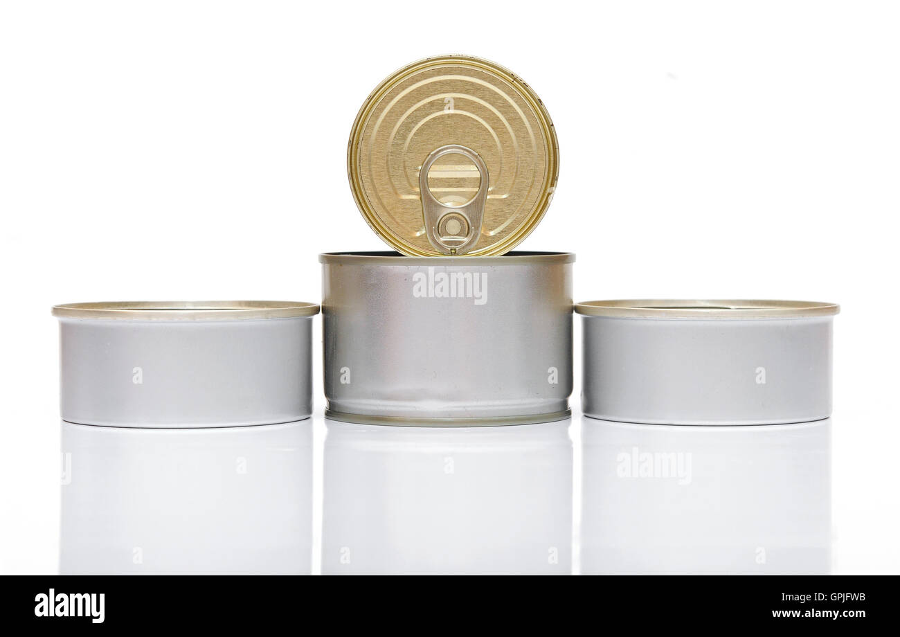 Pile of cans of conserved food over white background Stock Photo - Alamy