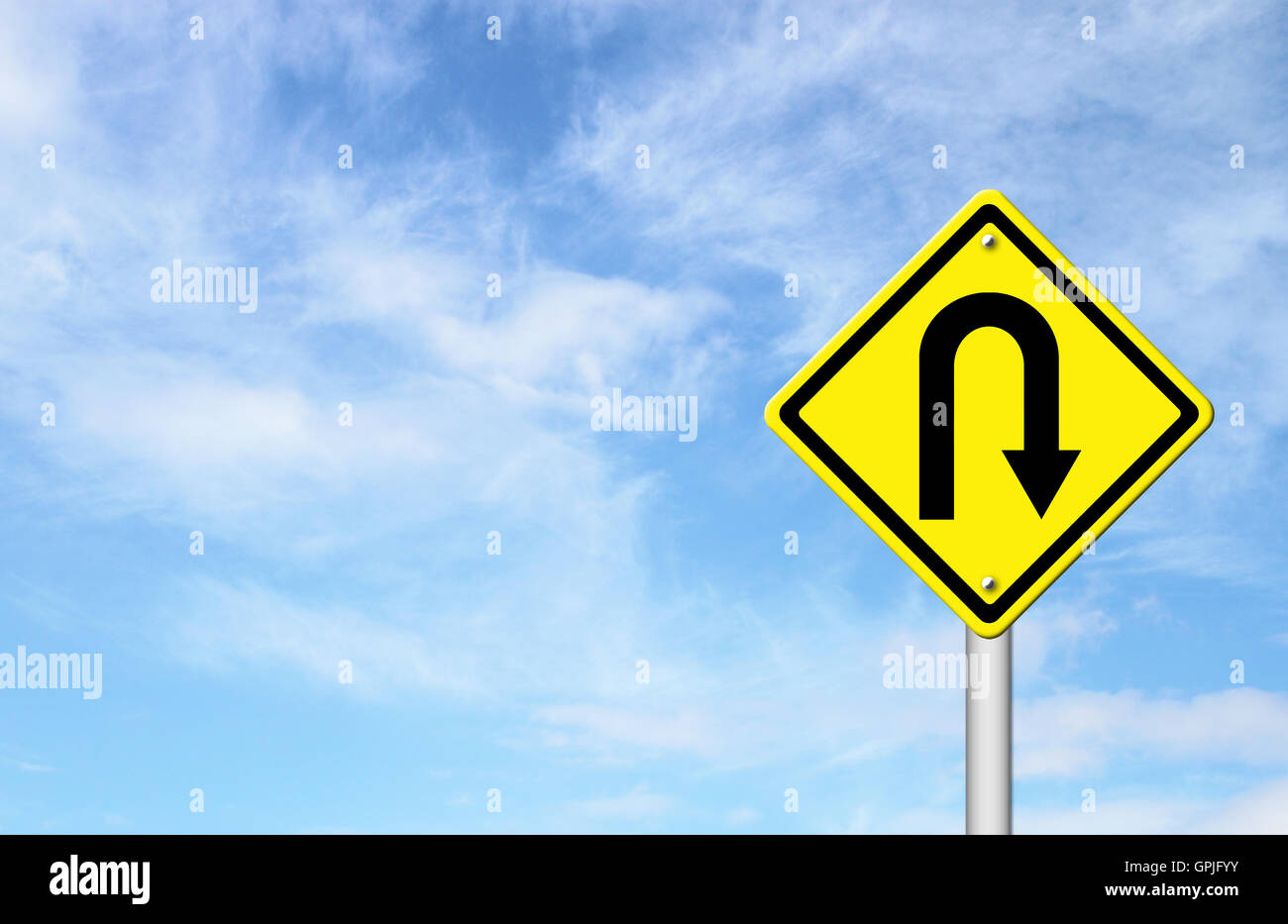 Yellow warning sign u-turn roadsign with blue sky background Stock ...