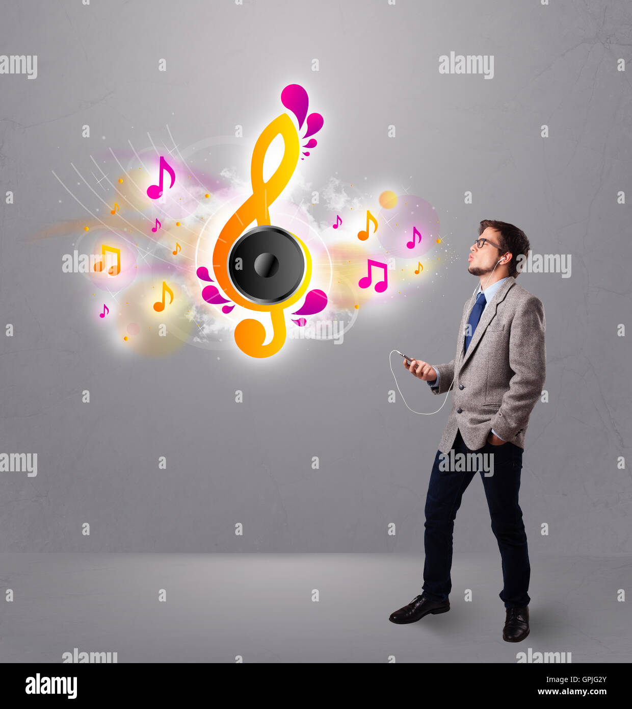 young man singing and listening to music with musical notes Stock Photo ...