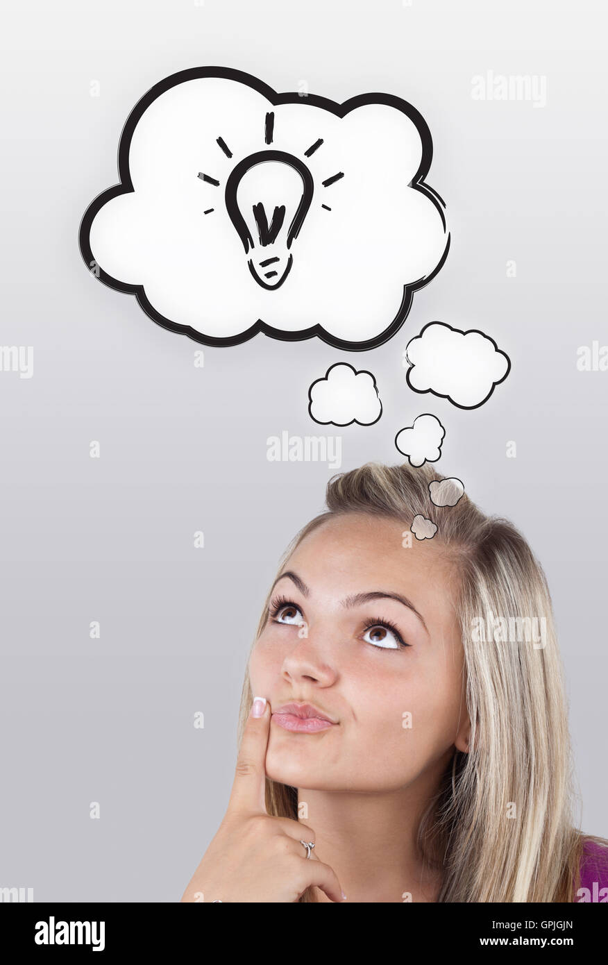 Young girl thinking with clouds Stock Photo - Alamy