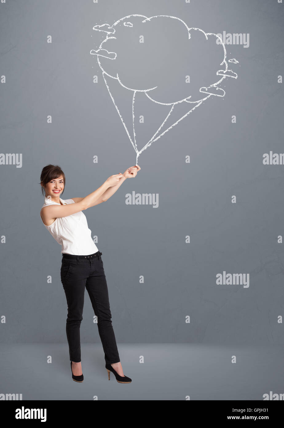 Pretty lady holding a cloud balloon drawing Stock Photo - Alamy