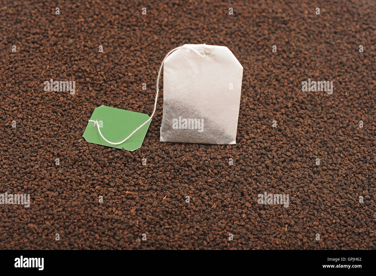 teabag on black tea background Stock Photo - Alamy