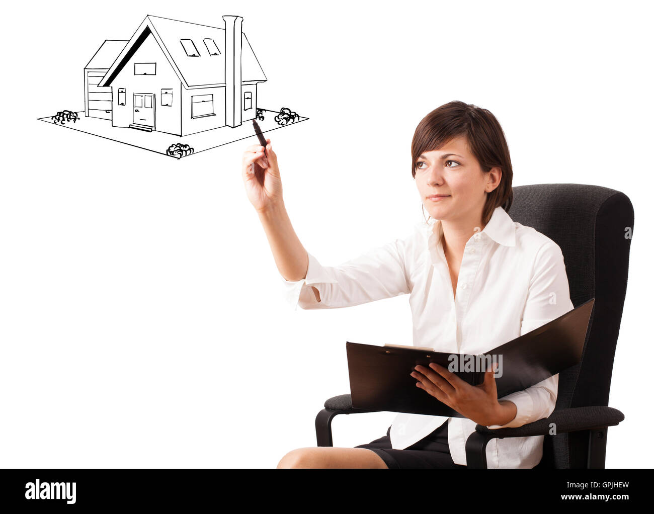 Young woman drawing a house on whiteboard Stock Photo - Alamy