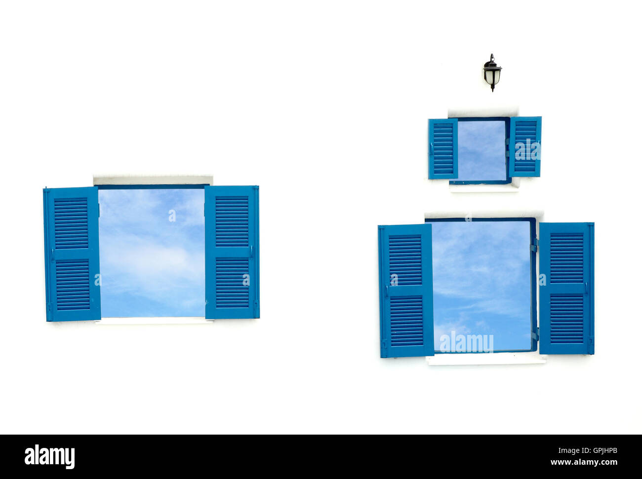 Greek style windows with blue sky Stock Photo - Alamy