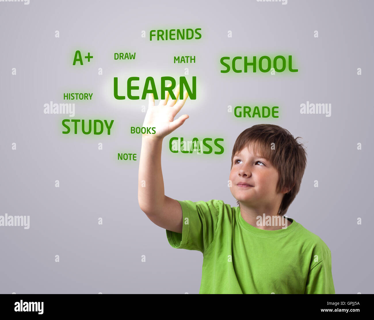 Kid touching LEARN button Stock Photo - Alamy