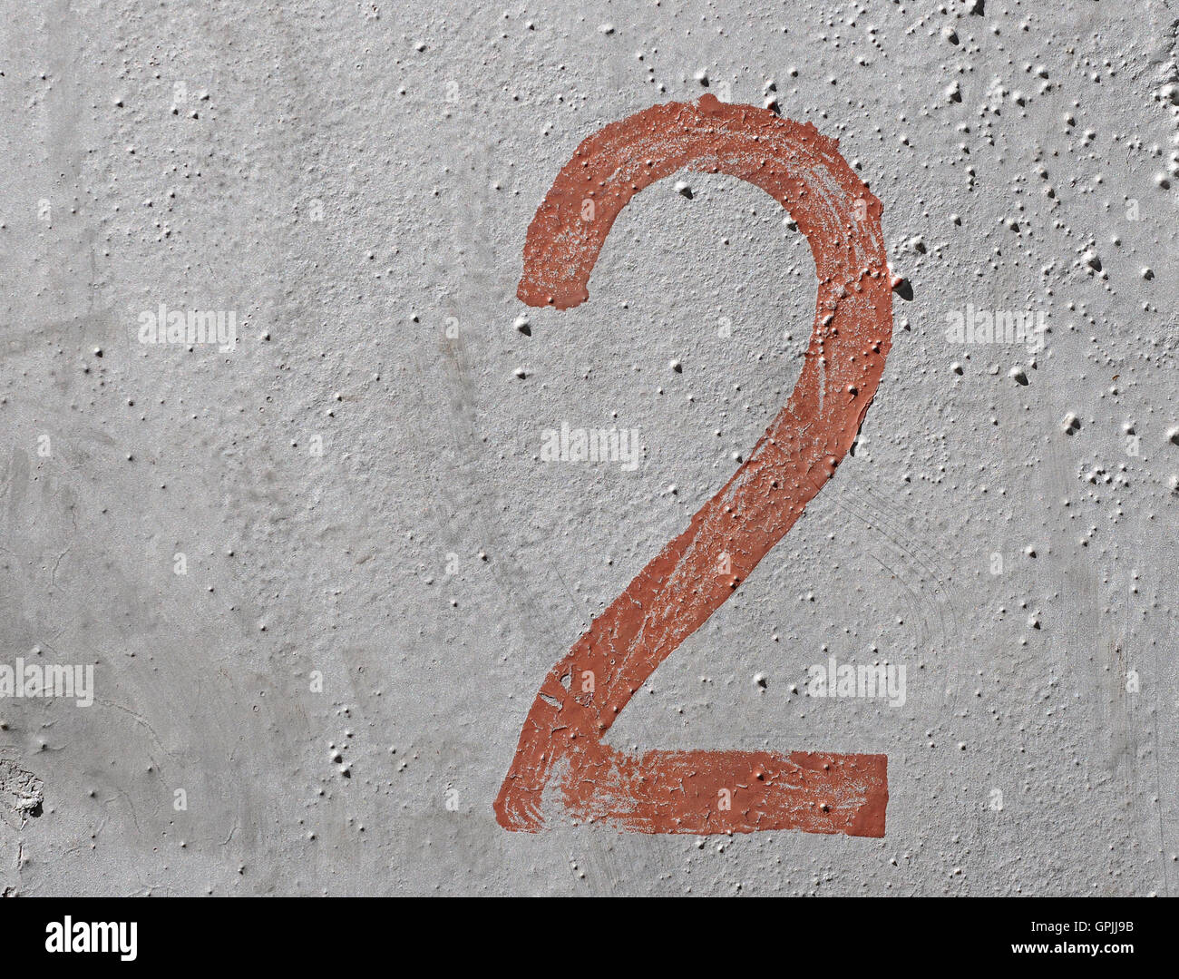 2 - old brown handwritten number over grunge silver background Stock ...