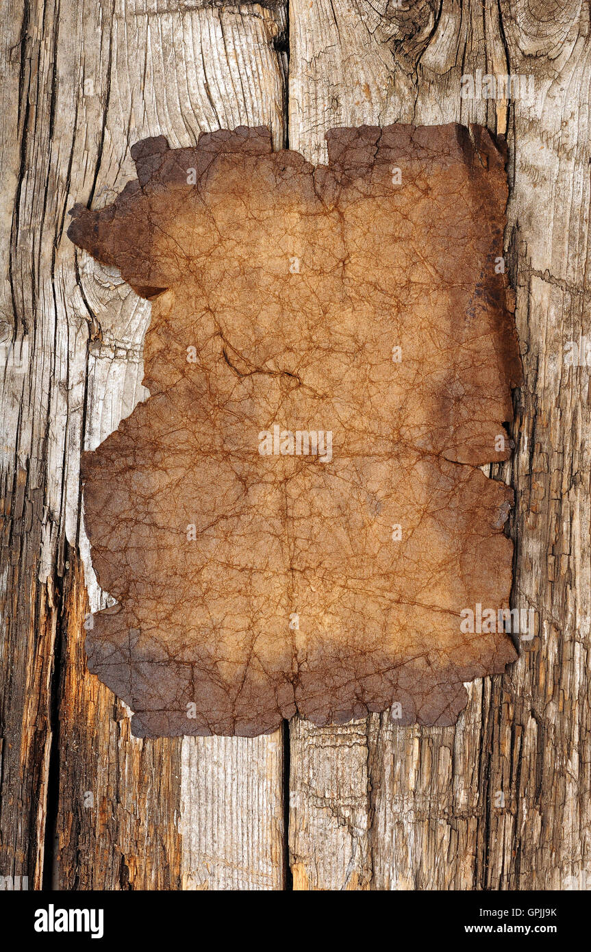 Old paper sheet over wooden background Stock Photo - Alamy