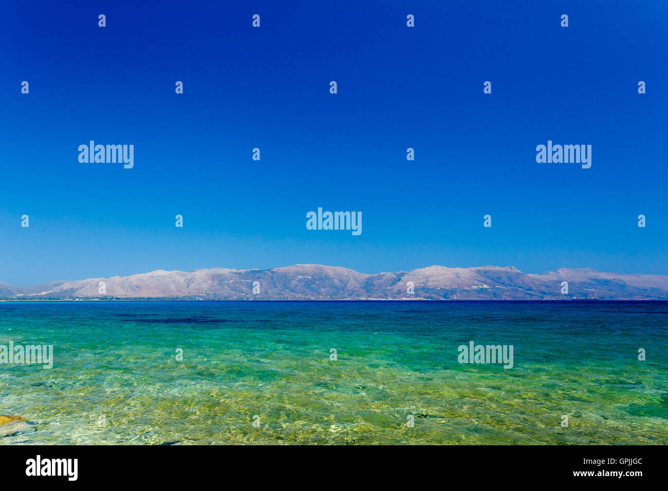 Sea water and mountains in distance green natural background texture ...