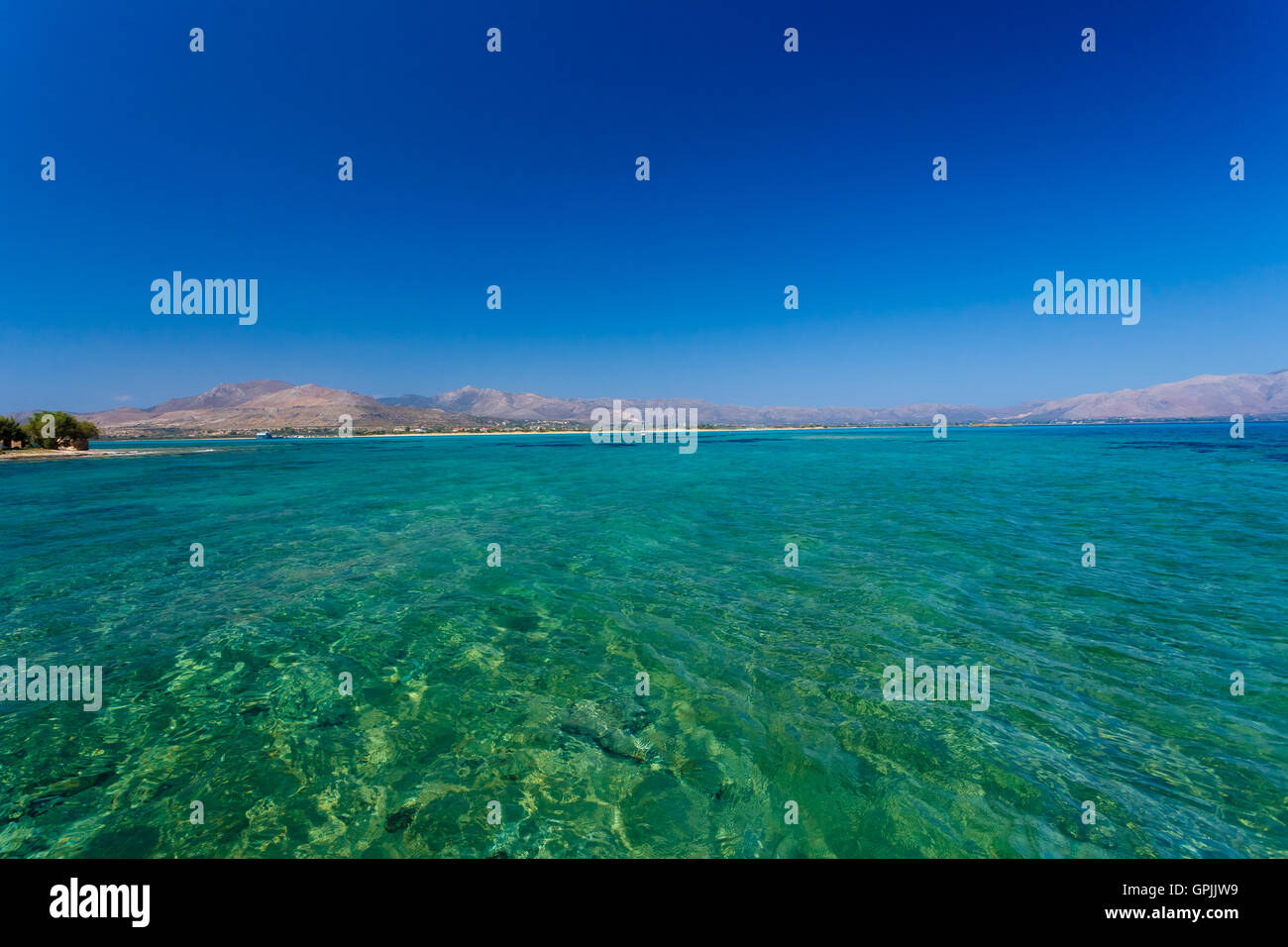 Sea water and mountains in distance green natural background texture ...
