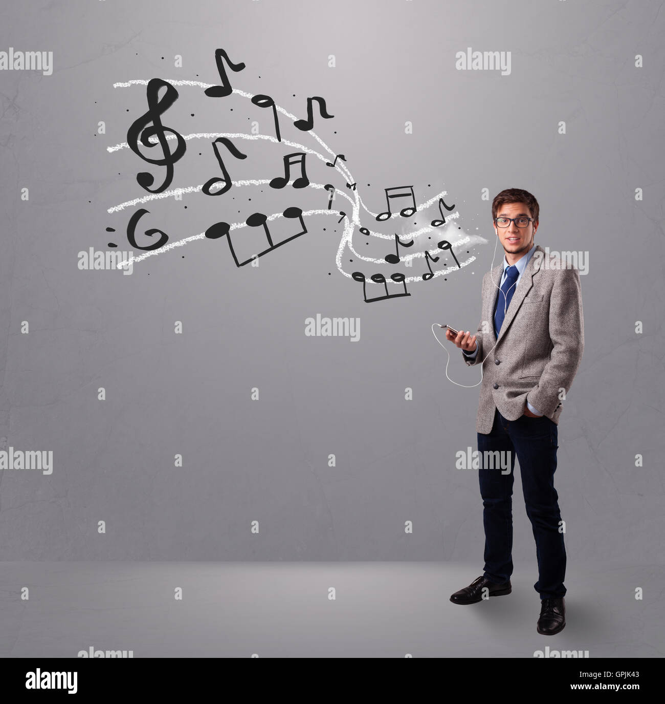 handsome boy singing and listening to music with musical notes Stock ...