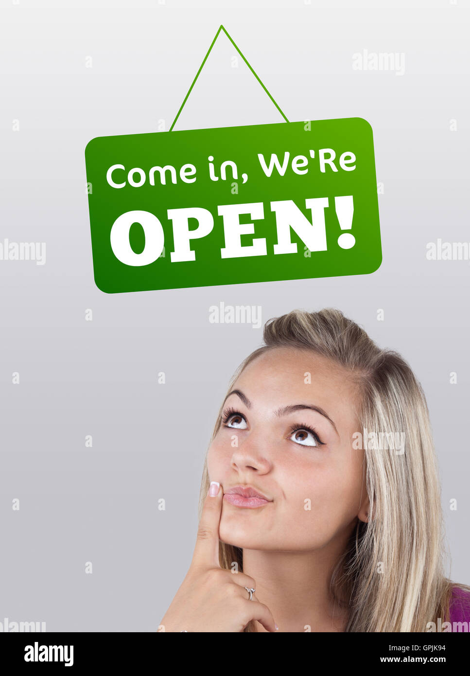 Young girl head looking at closed and open signs Stock Photo - Alamy