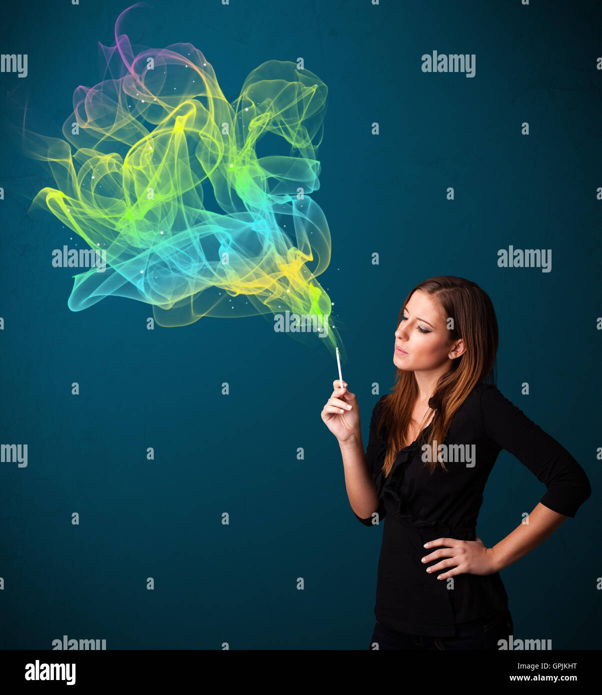 Pretty lady smoking cigarette with colorful smoke Stock Photo - Alamy