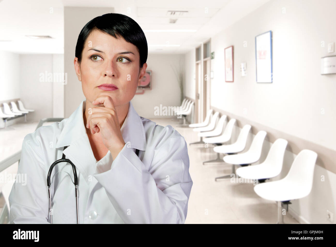 Thinking medical doctor thinking looking up smiling, Medical wom Stock ...