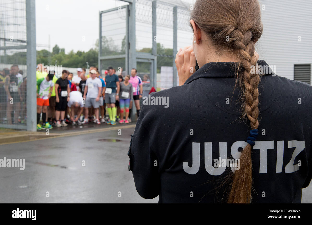 Prisoners and external athletes running along the prison during the 1st ...