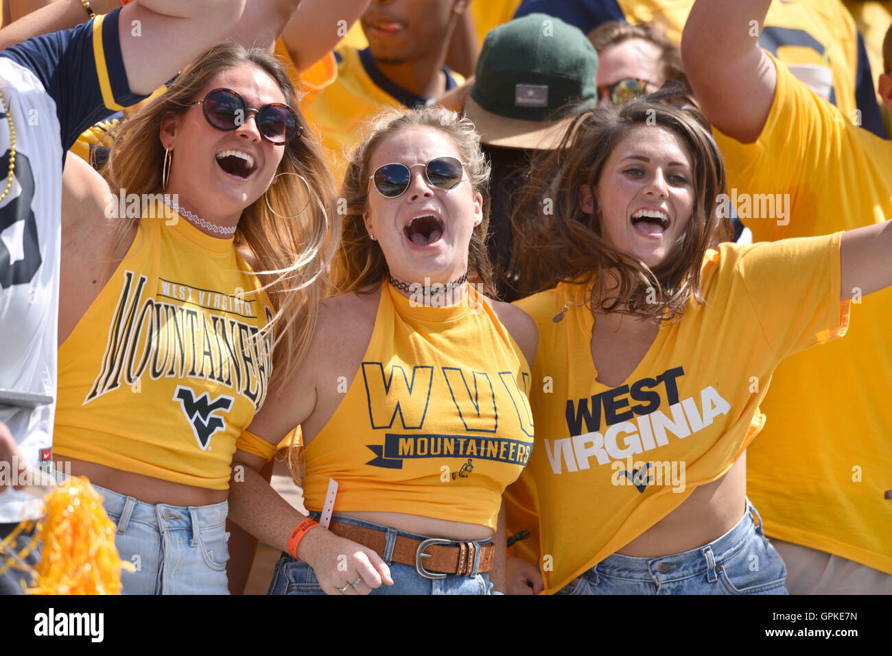 Morgantown, West Virginia, USA. 3rd Sep, 2016. Three WVU fans celebrate ...
