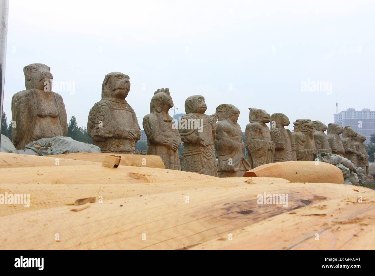 Twelve ancient stone statues of Chinese Zodiac animals at a ...