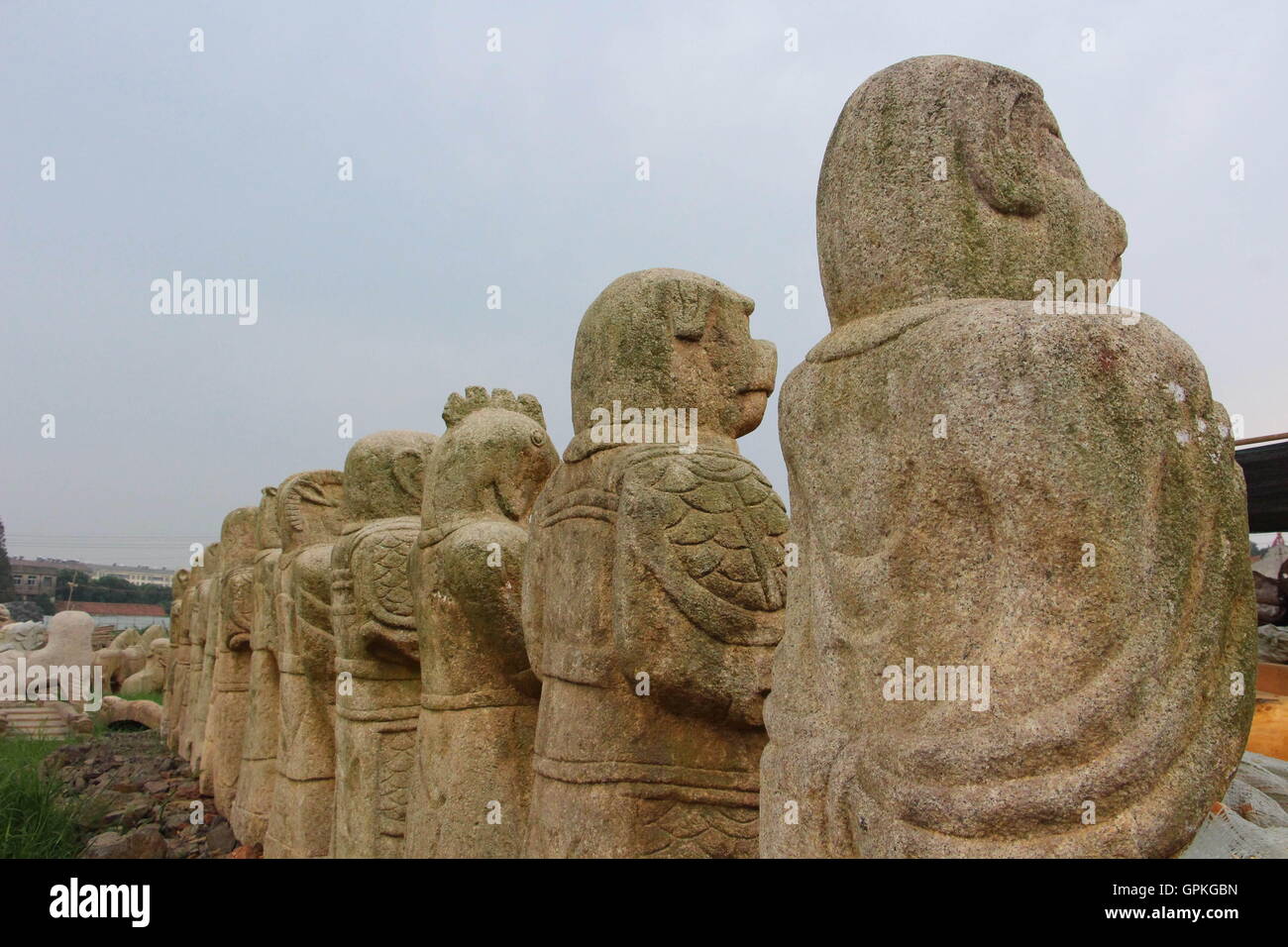 Twelve ancient stone statues of Chinese Zodiac animals at a ...