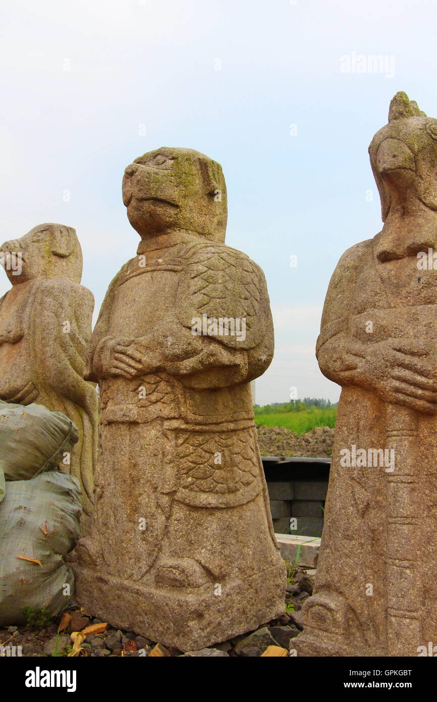 Twelve ancient stone statues of Chinese Zodiac animals at a ...