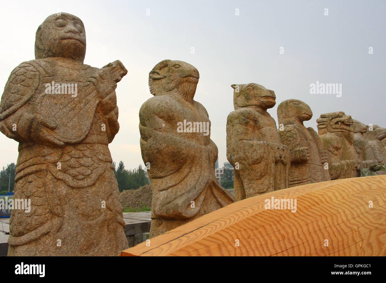 Twelve ancient stone statues of Chinese Zodiac animals at a ...