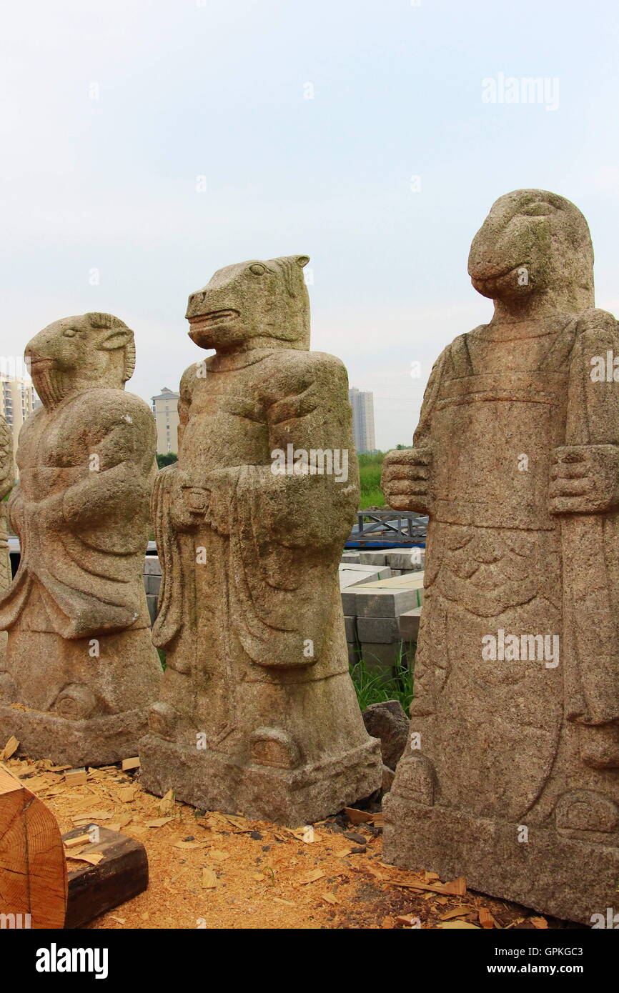 Twelve ancient stone statues of Chinese Zodiac animals at a ...