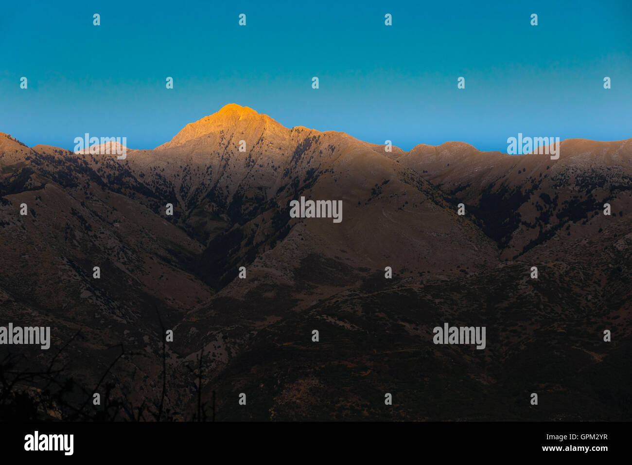 The emblematic Taygetus Mountain with the day's first light hitting the ...