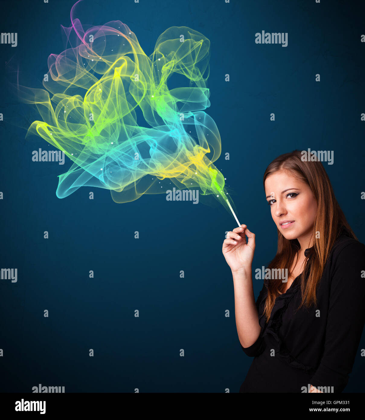 Pretty lady smoking cigarette with colorful smoke Stock Photo - Alamy