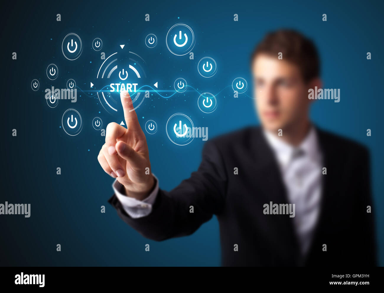 Businessman pressing simple type of start buttons Stock Photo - Alamy