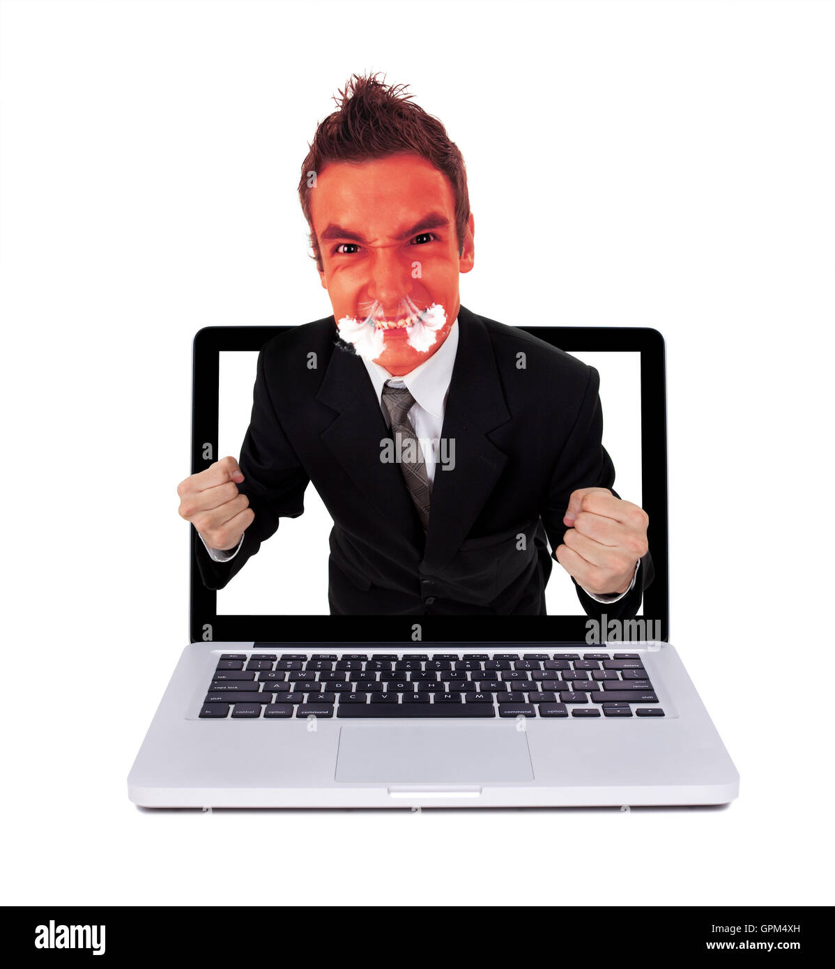 Angry man coming out from laptop Stock Photo - Alamy