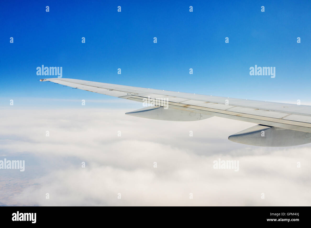 Airplane wing out of window Stock Photo - Alamy
