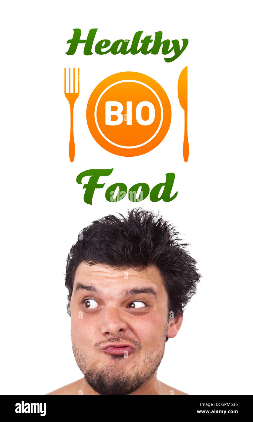 Young head looking at healthy food sign Stock Photo - Alamy