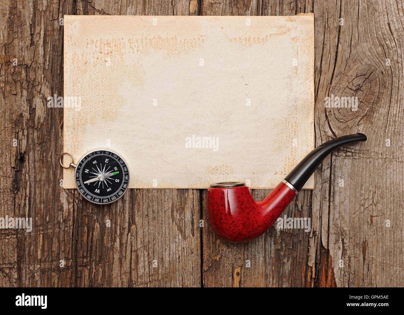 Compass and pipe on the old paper background Stock Photo - Alamy