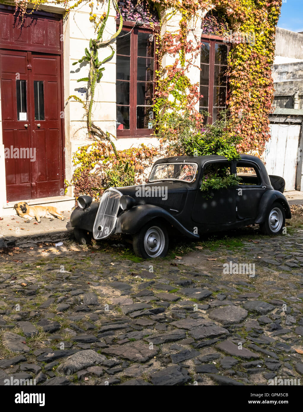 old car parked in front of the old house Stock Photo - Alamy