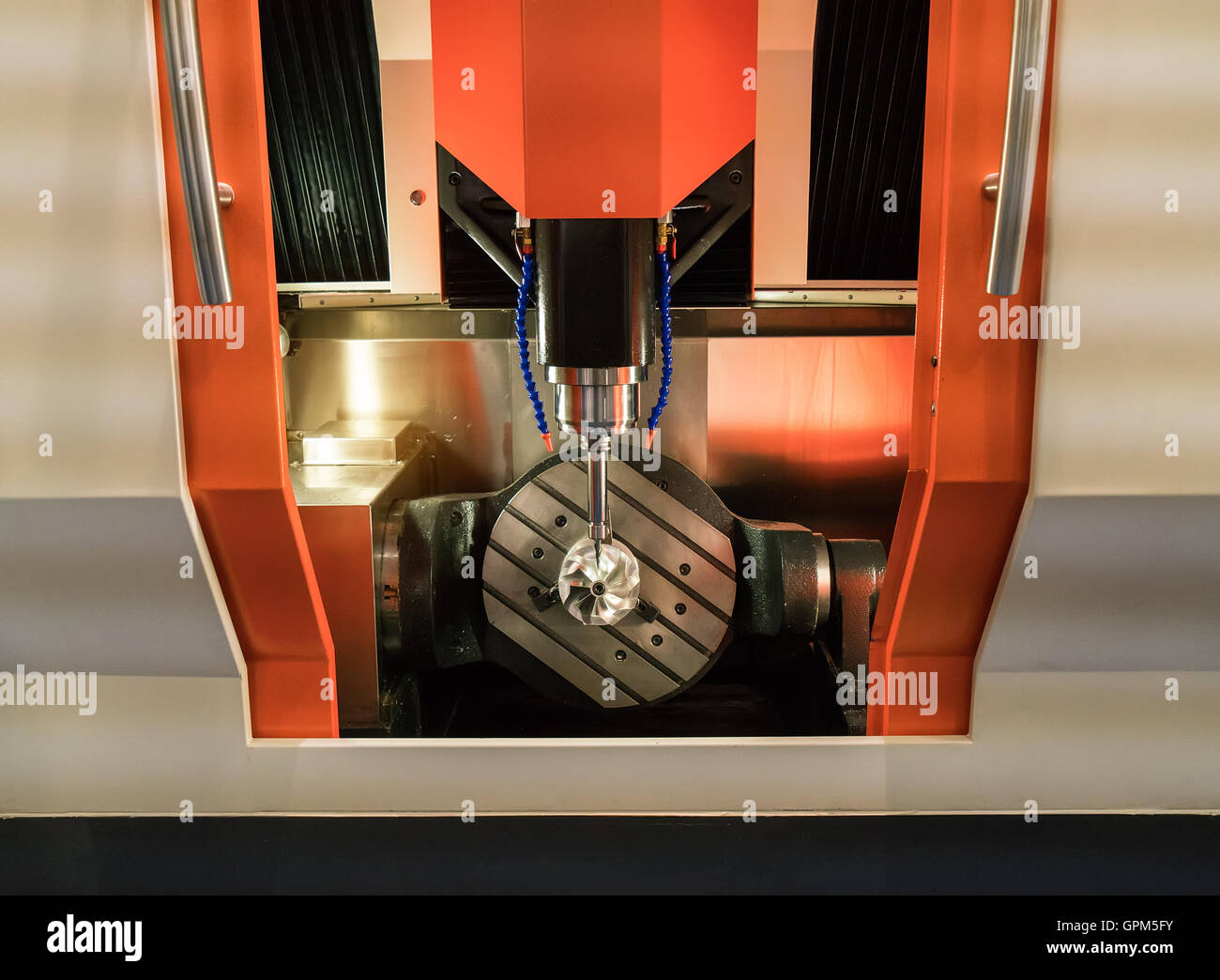 CNC milling machine milling heads in metal industry Stock Photo - Alamy