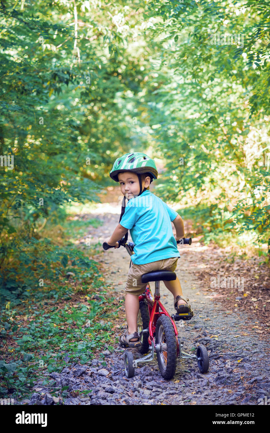 Child riding a bicycle Stock Photo - Alamy