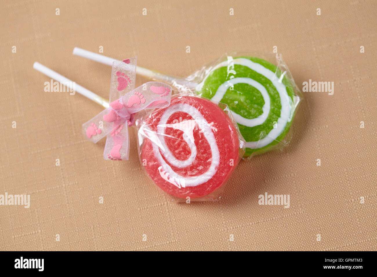candy on a stick on a beige background Stock Photo - Alamy