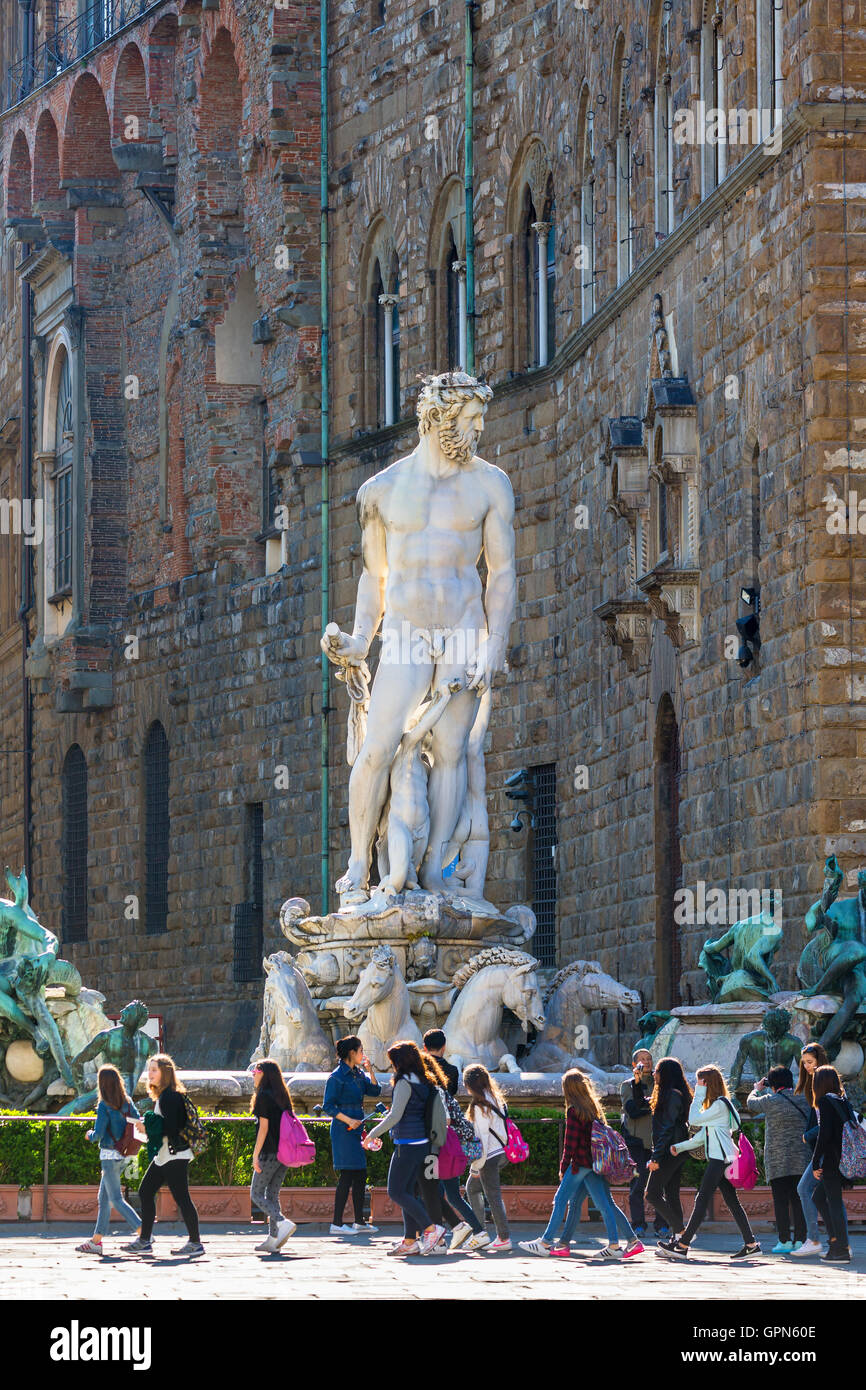 Young people at the Fountain of Neptune statue in Florence Stock Photo ...