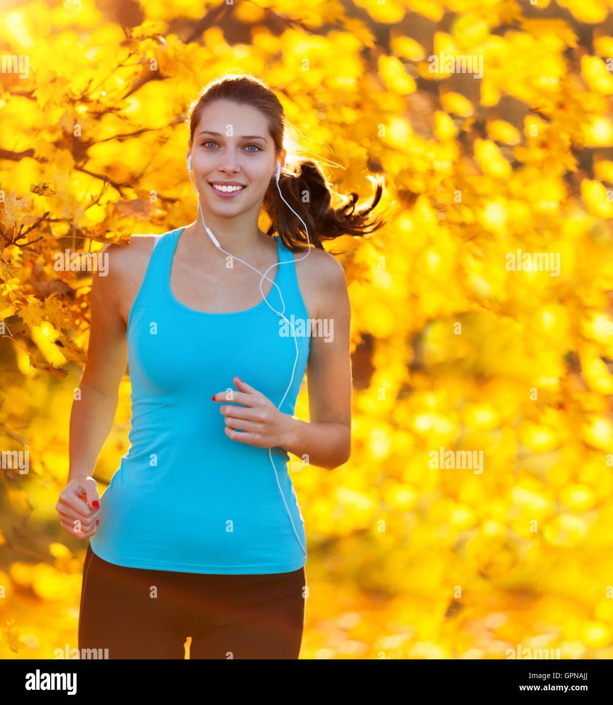 Athlete young woman running in morning sunrise training for marathon ...