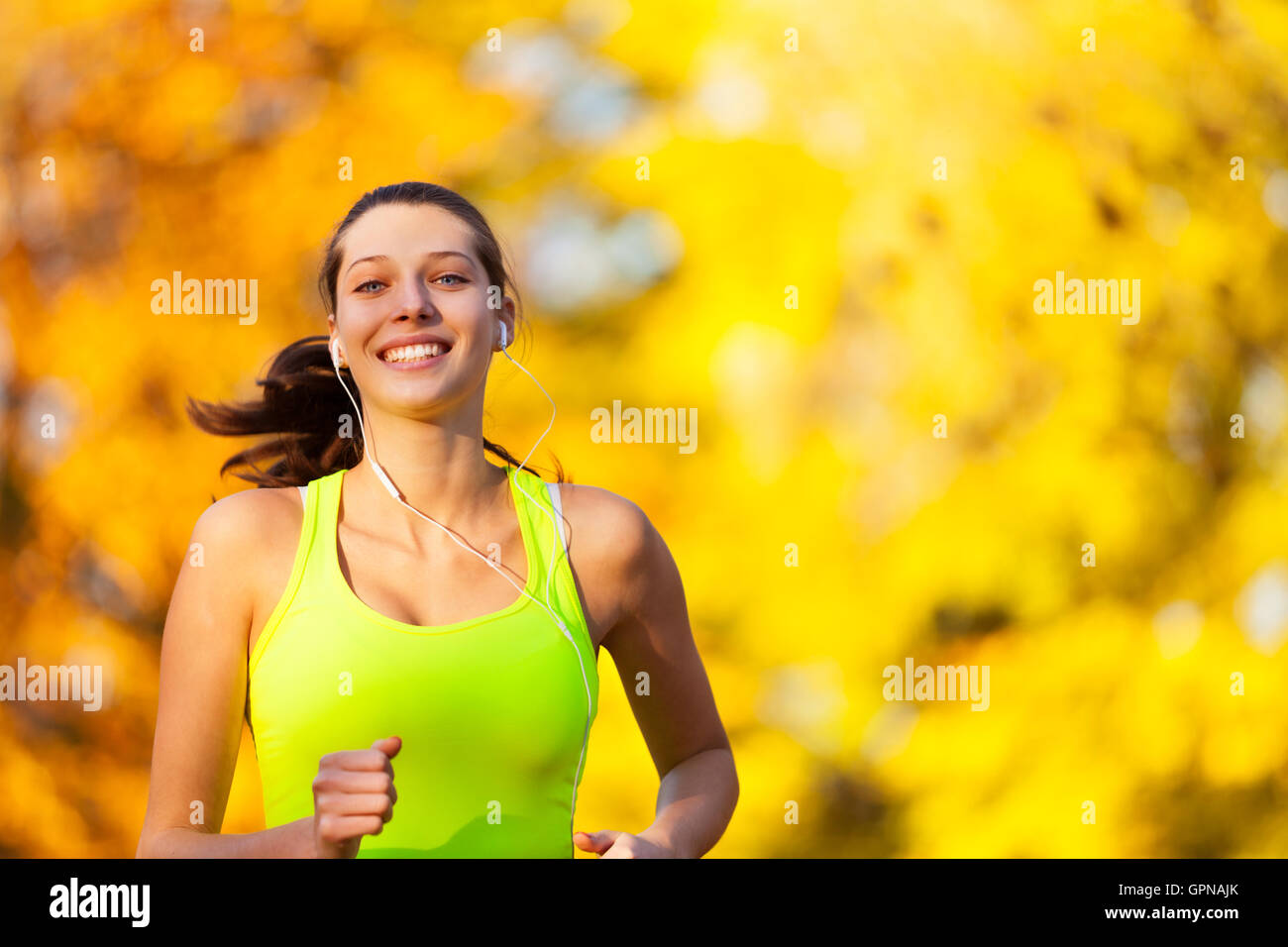 Athlete young woman running in morning sunrise training for marathon ...