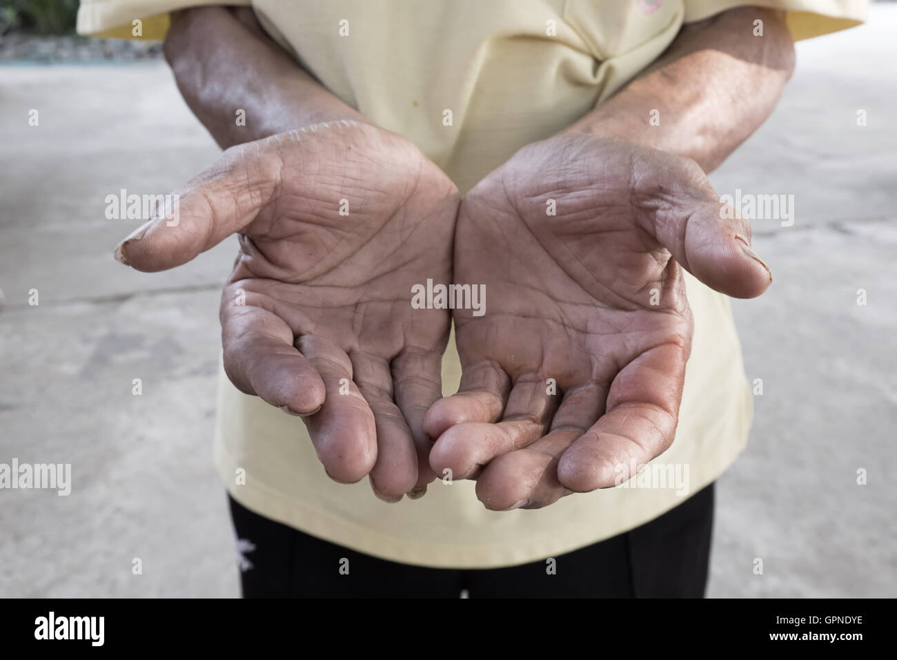 Tinker old man hand begging for money. because of the hunger Stock ...