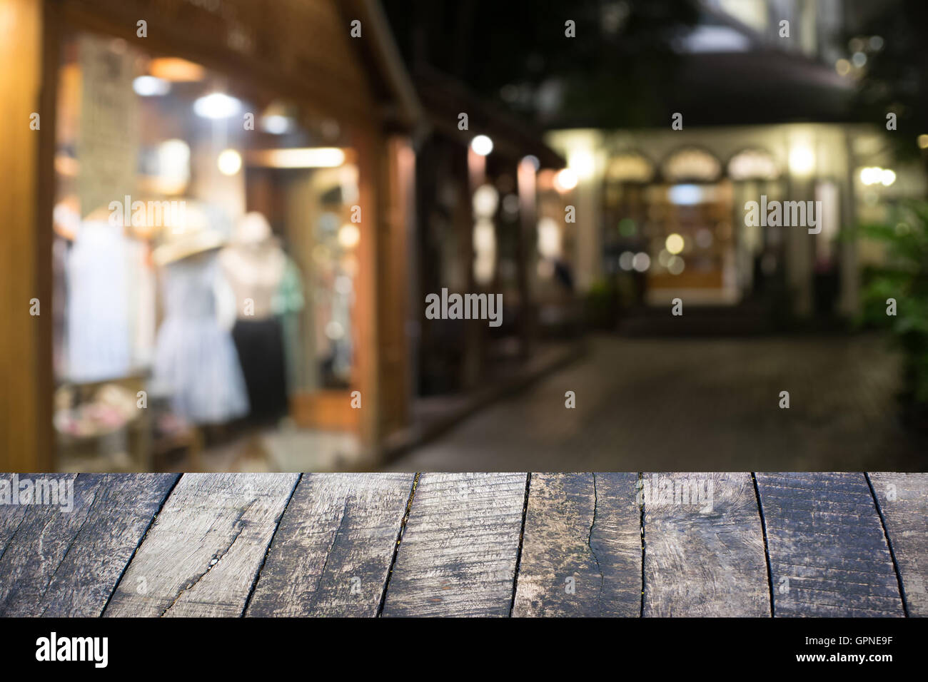 Empty wooden table and booked at hotel in night Stock Photo - Alamy