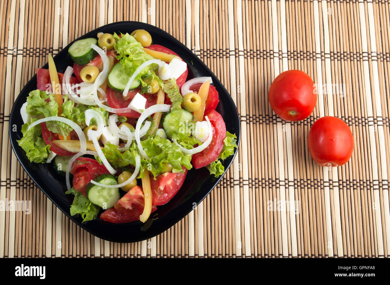 Aerial view of one portion of vegetable salad of tomato, cucumber ...