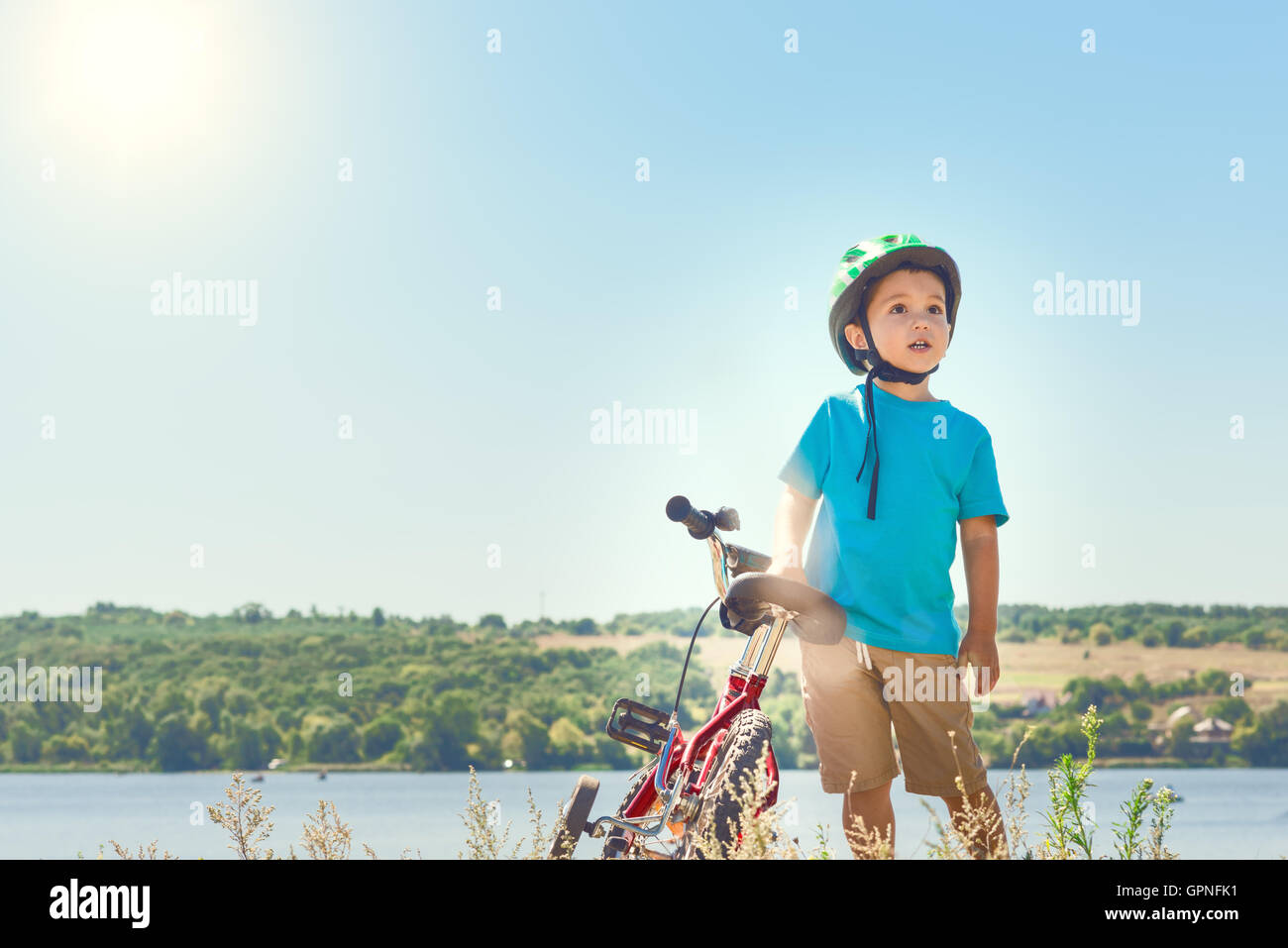Child riding a bicycle Stock Photo - Alamy