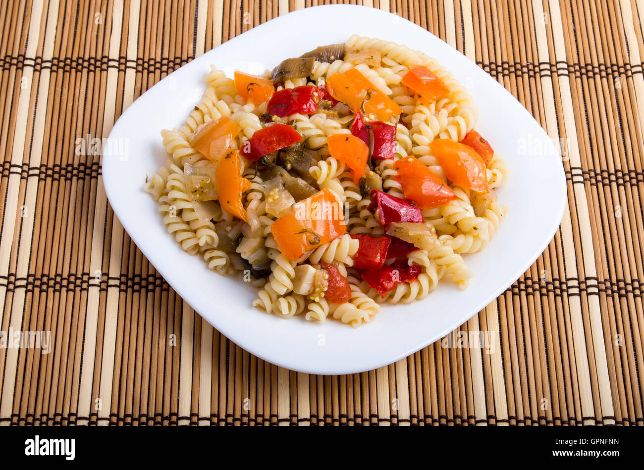 Italian pasta fusilli with vegetable ragout of peppers and steamed ...