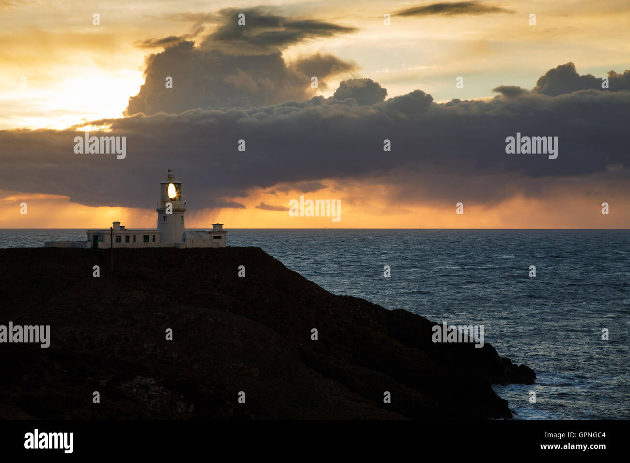Lighthouse at Strumble Head at sunset, Pembrokeshire, Wales Stock Photo ...