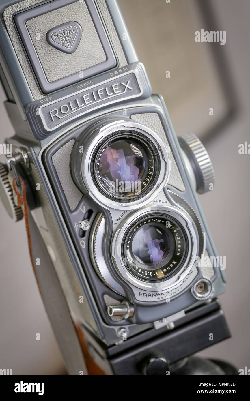 A grey "baby" Rolleiflex twin lens camera using 127 roll film. A high ...