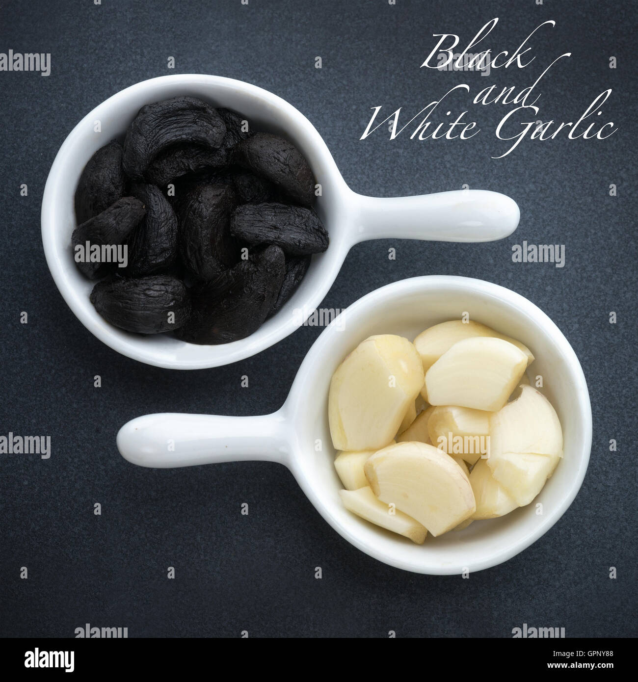 Square macro image of Black and white Garlic in small white pots on a ...