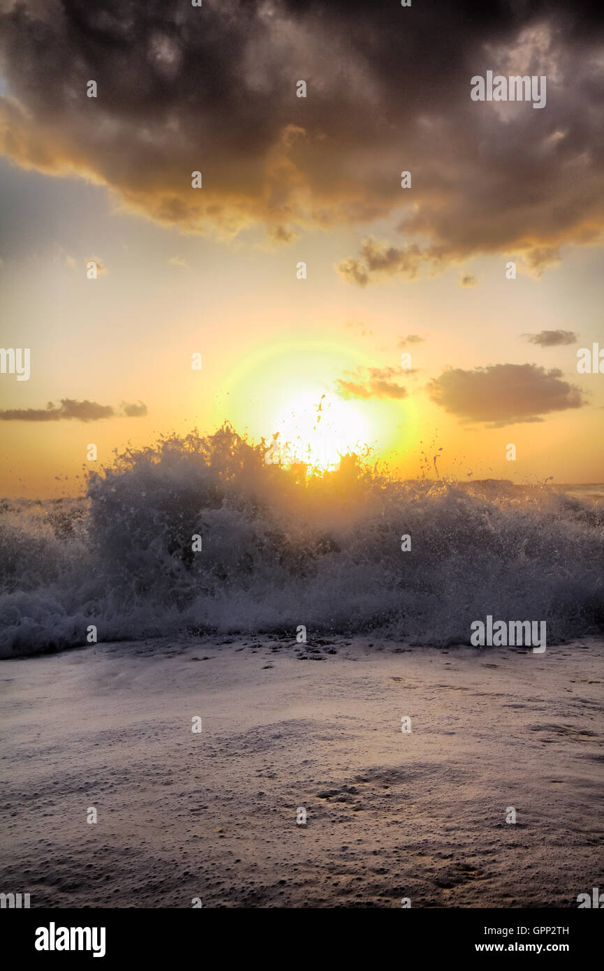 Gentle warm sea on backdrop of enchanting sunset. Foamy surf ...