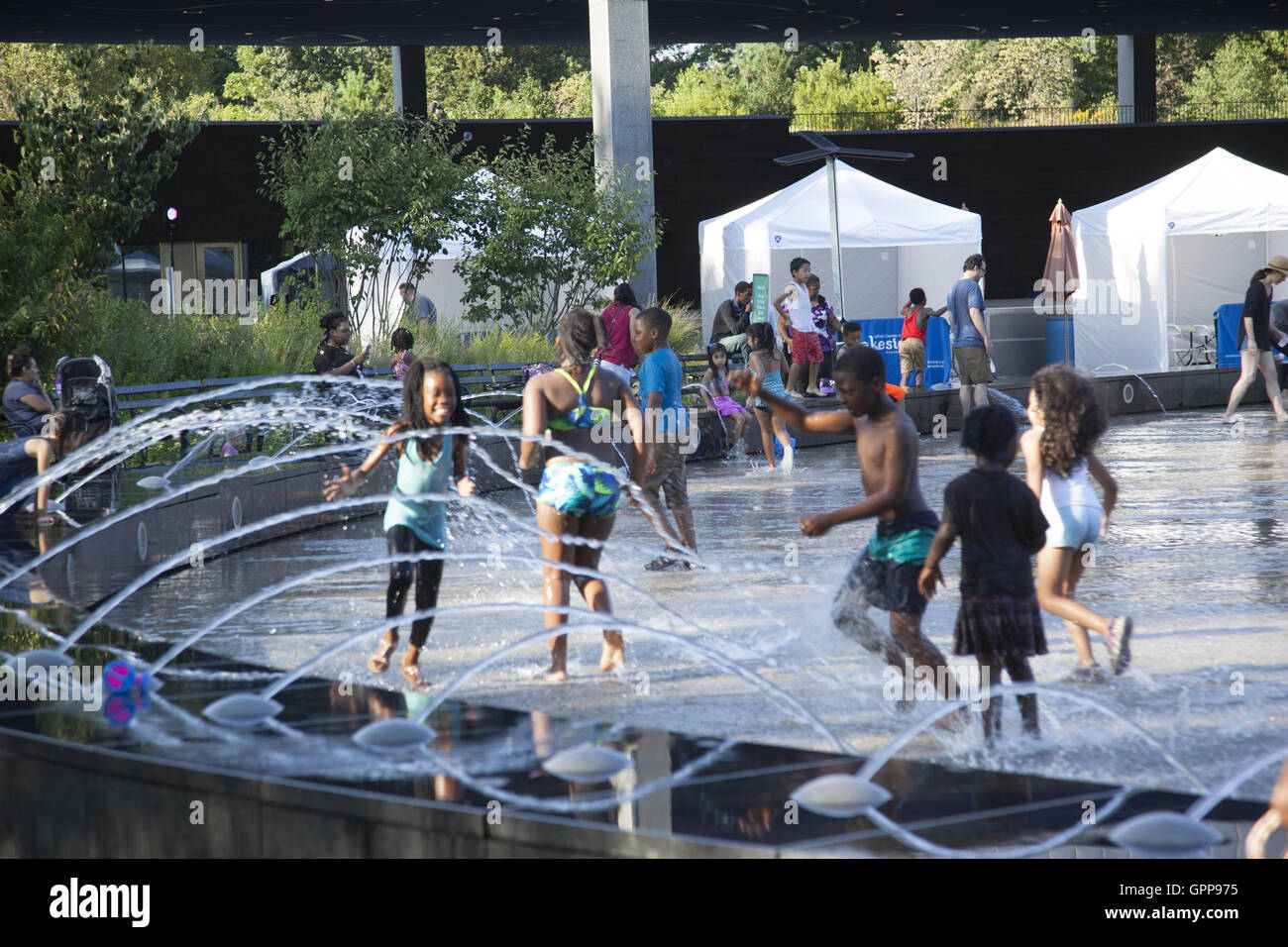 Children have fun and cool off during the summer heat wave 2016 at the ...