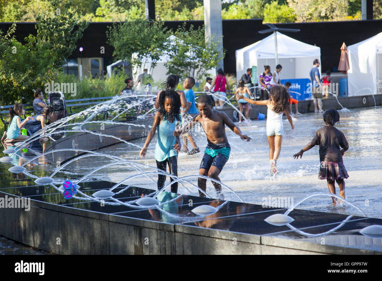 Children have fun and cool off during the summer heat wave 2016 at the ...
